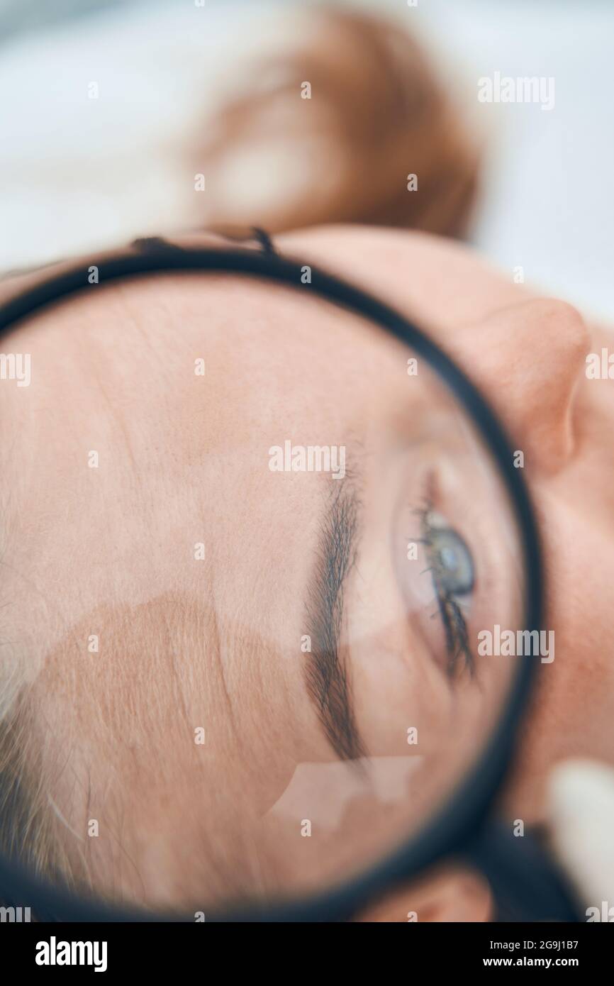 Focused photo on female forehead being with wrinkles Stock Photo - Alamy