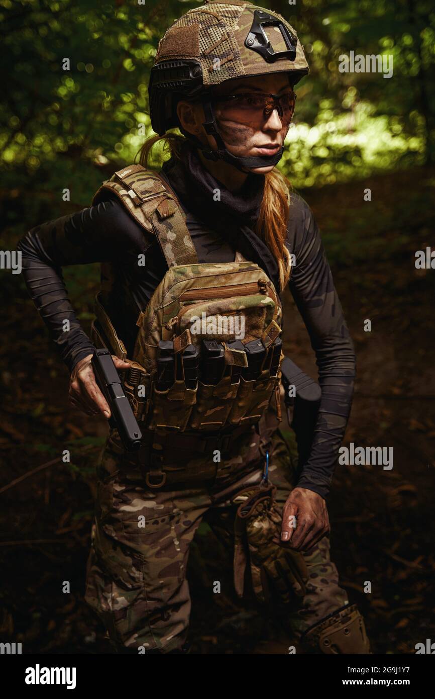 Female person searching of target in forest Stock Photo - Alamy
