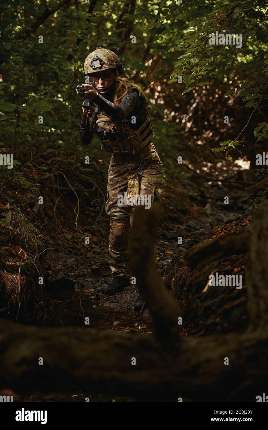 Soldier standing in fighting stance and aiming at target Stock Photo ...