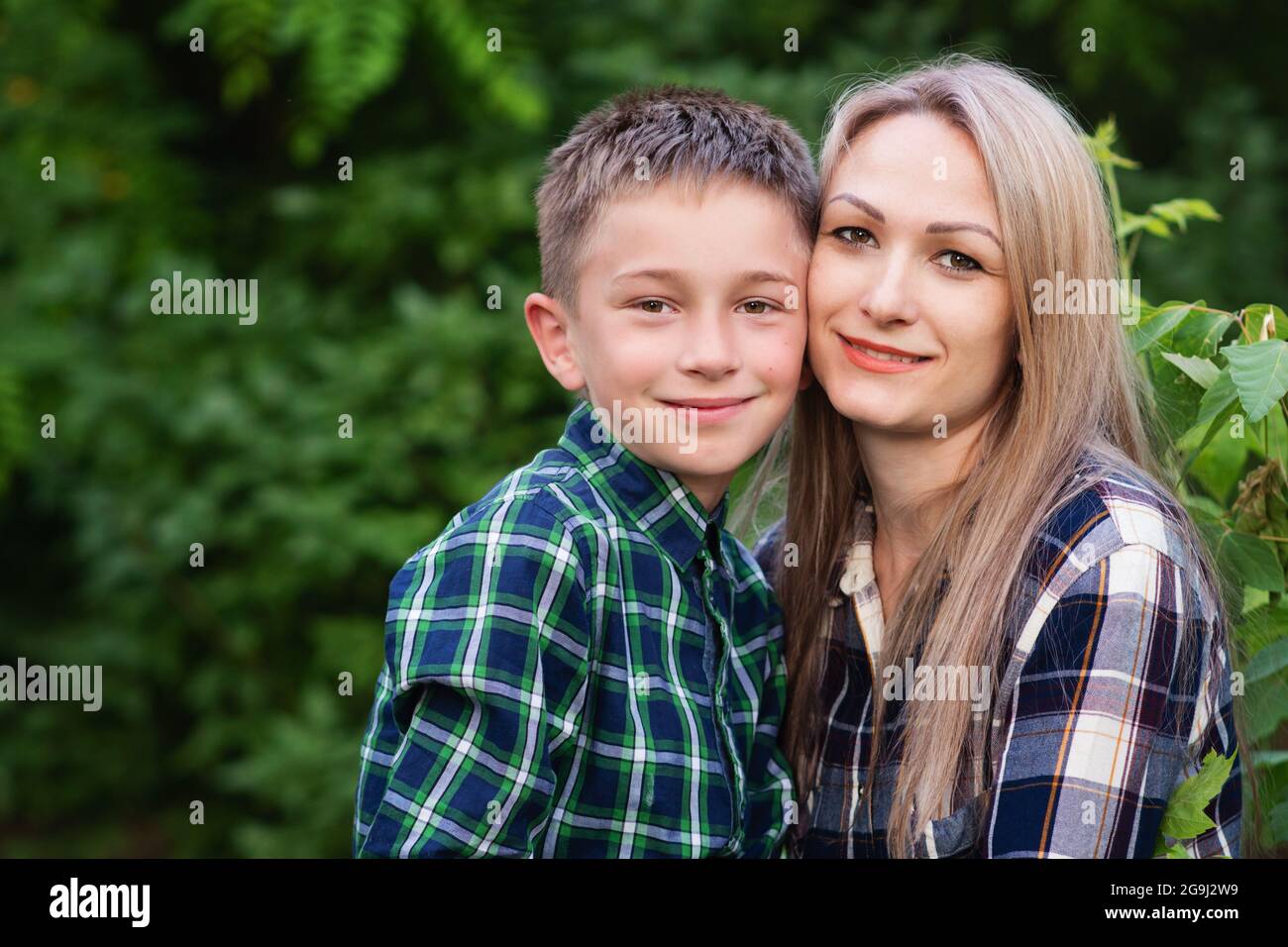 Portrait Of Nice Young Mother With Pleasure Spending Time With Precious