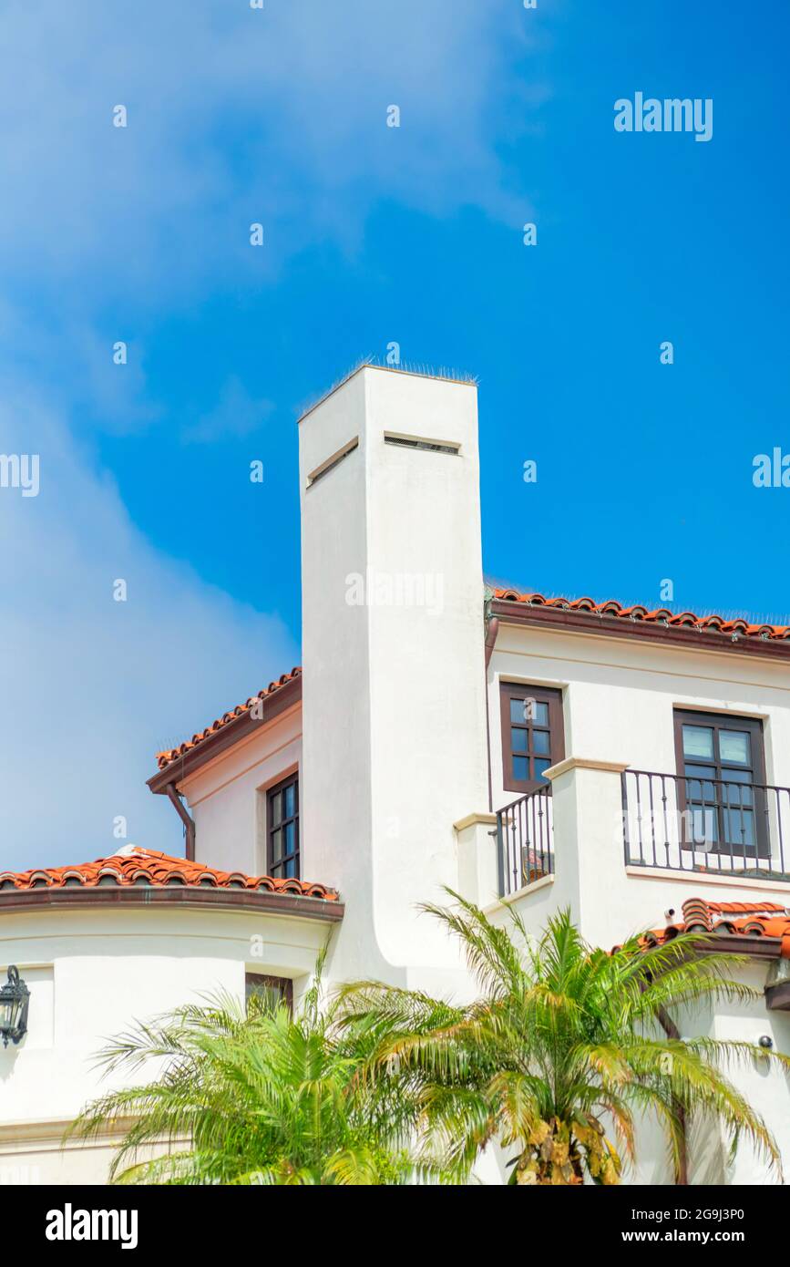 Exterior of a beautiful house building with a balcony under a cloudy ...