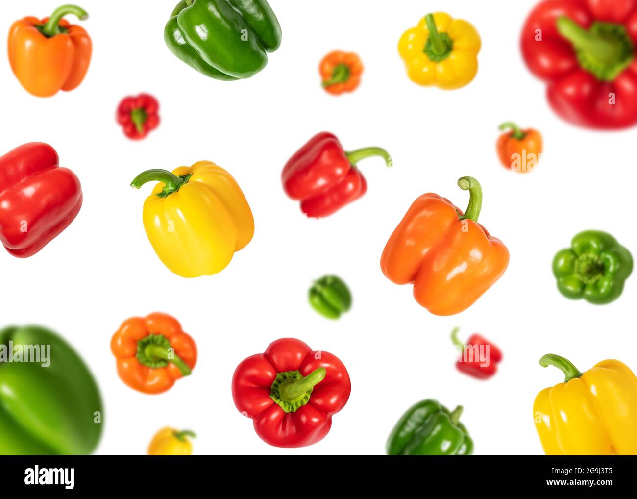 Set with flying colorful sweet peppers isolated on a white background ...