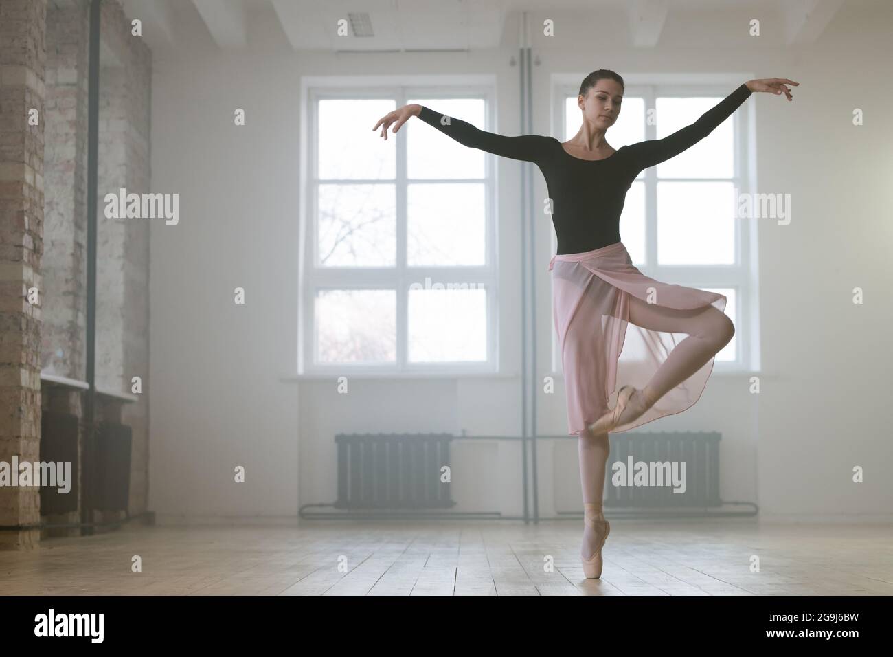 Young ballerina in tutu dress performing in dance school Stock Photo ...