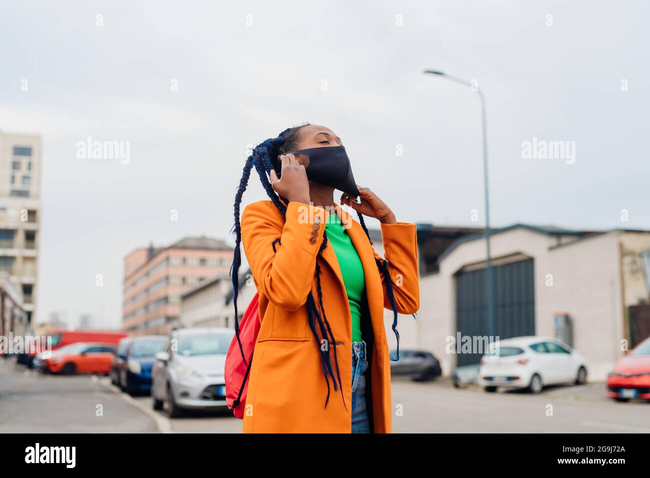 Woman removing face mask hi-res stock photography and images - Alamy