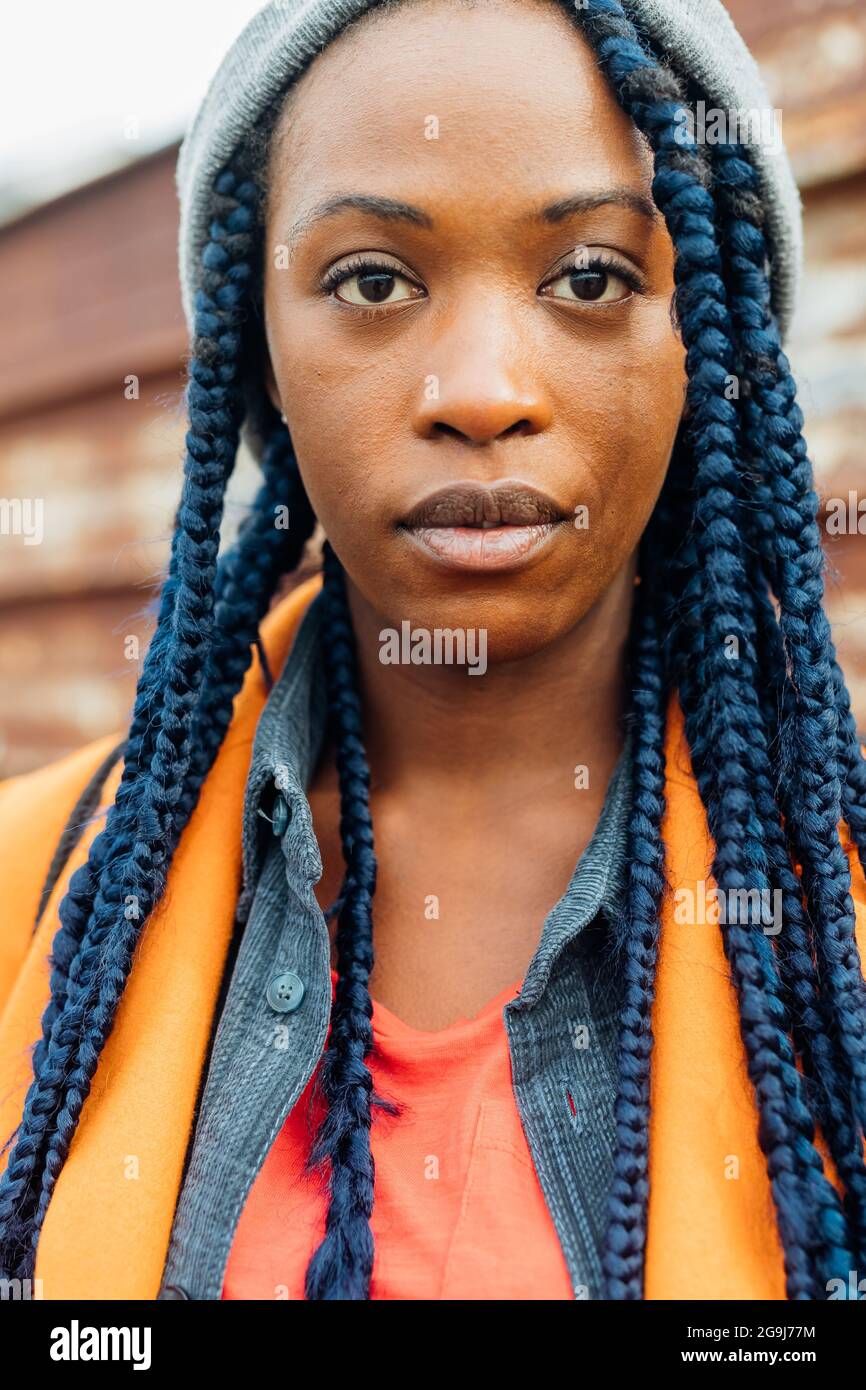 Italy, Milan, Portrait of woman with braided hair outdoors Stock Photo ...