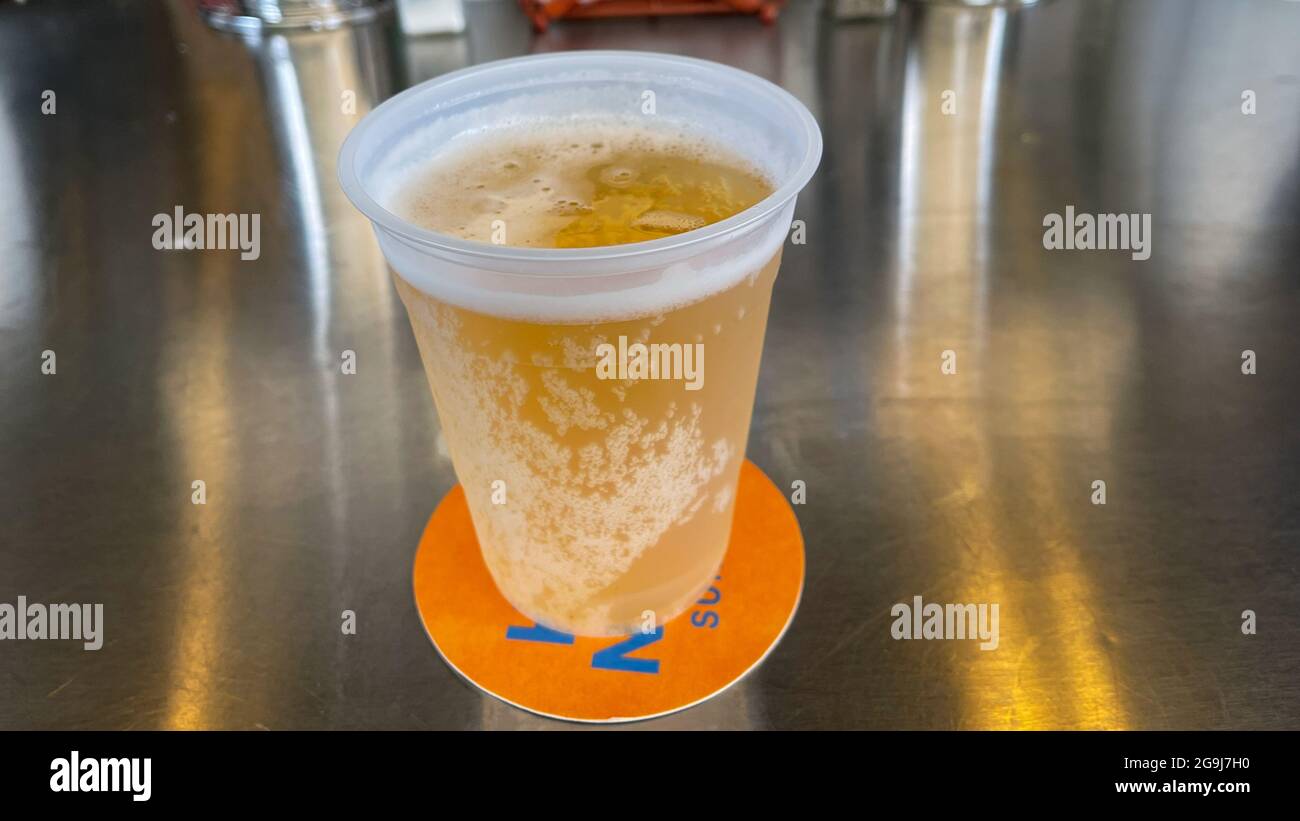 An icy cold draft beer in a glass sitting on a bar in Florida Stock ...
