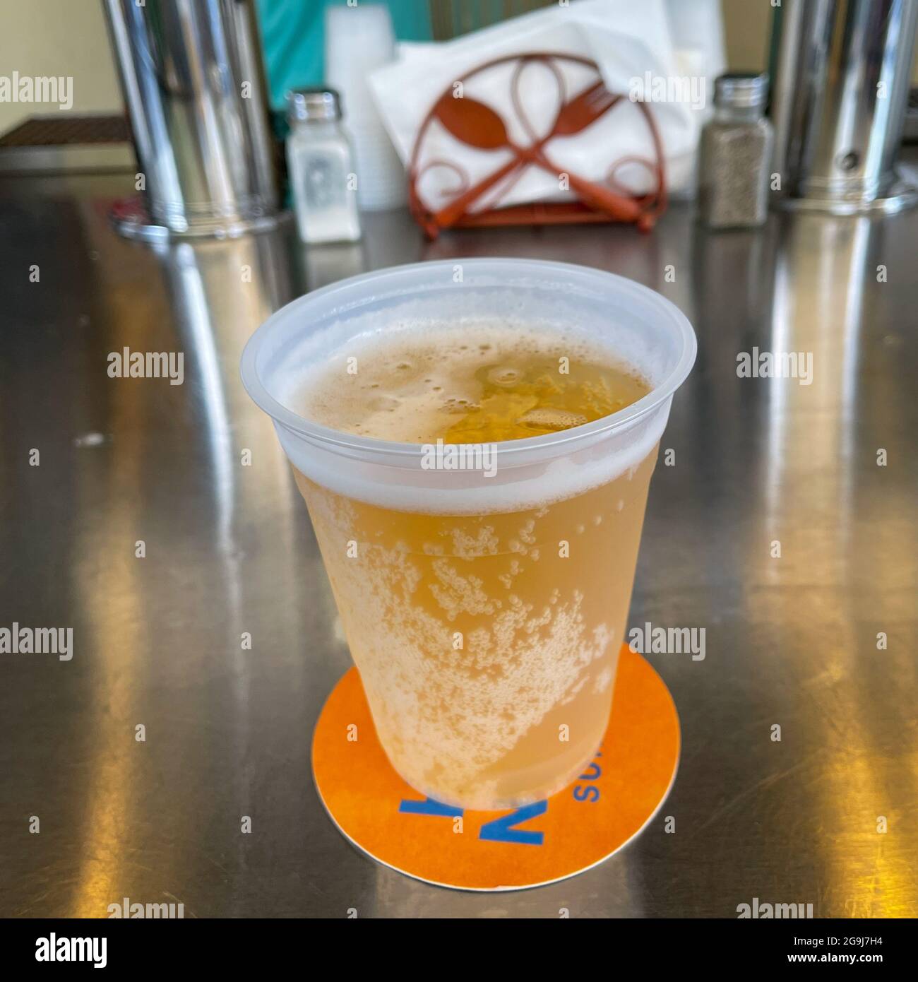 An icy cold draft beer in a glass sitting on a bar in Florida Stock ...