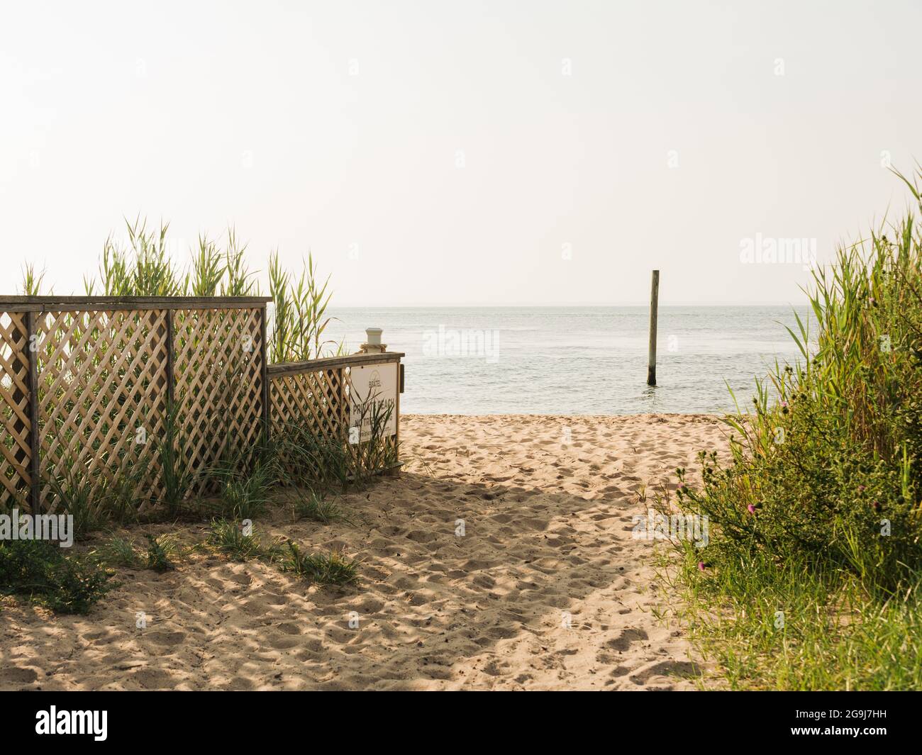Post in the water and a beach on Fire Island, New York Stock Photo - Alamy