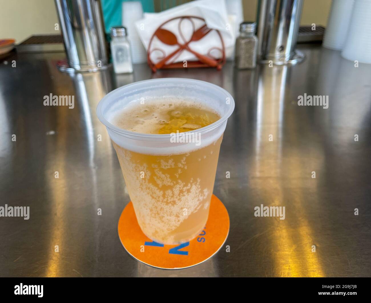 An icy cold draft beer in a glass sitting on a bar in Florida Stock ...