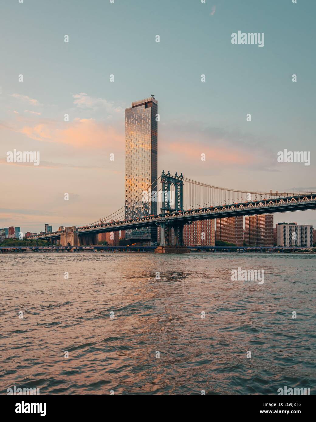 View of the Manhattan Bridge and East River at sunset, from Dumbo ...