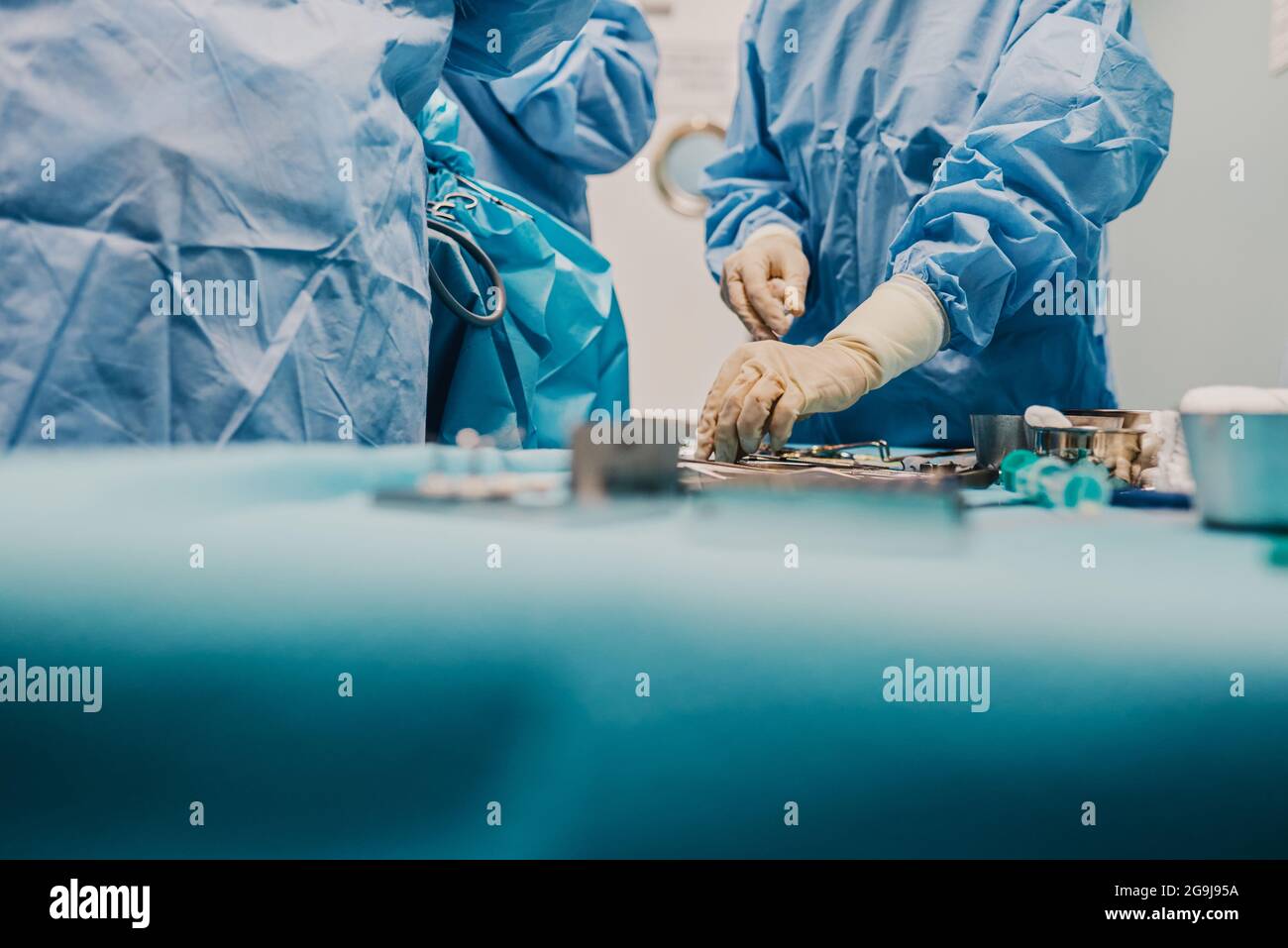 Medical team preparing surgical equipment for operation inside private ...