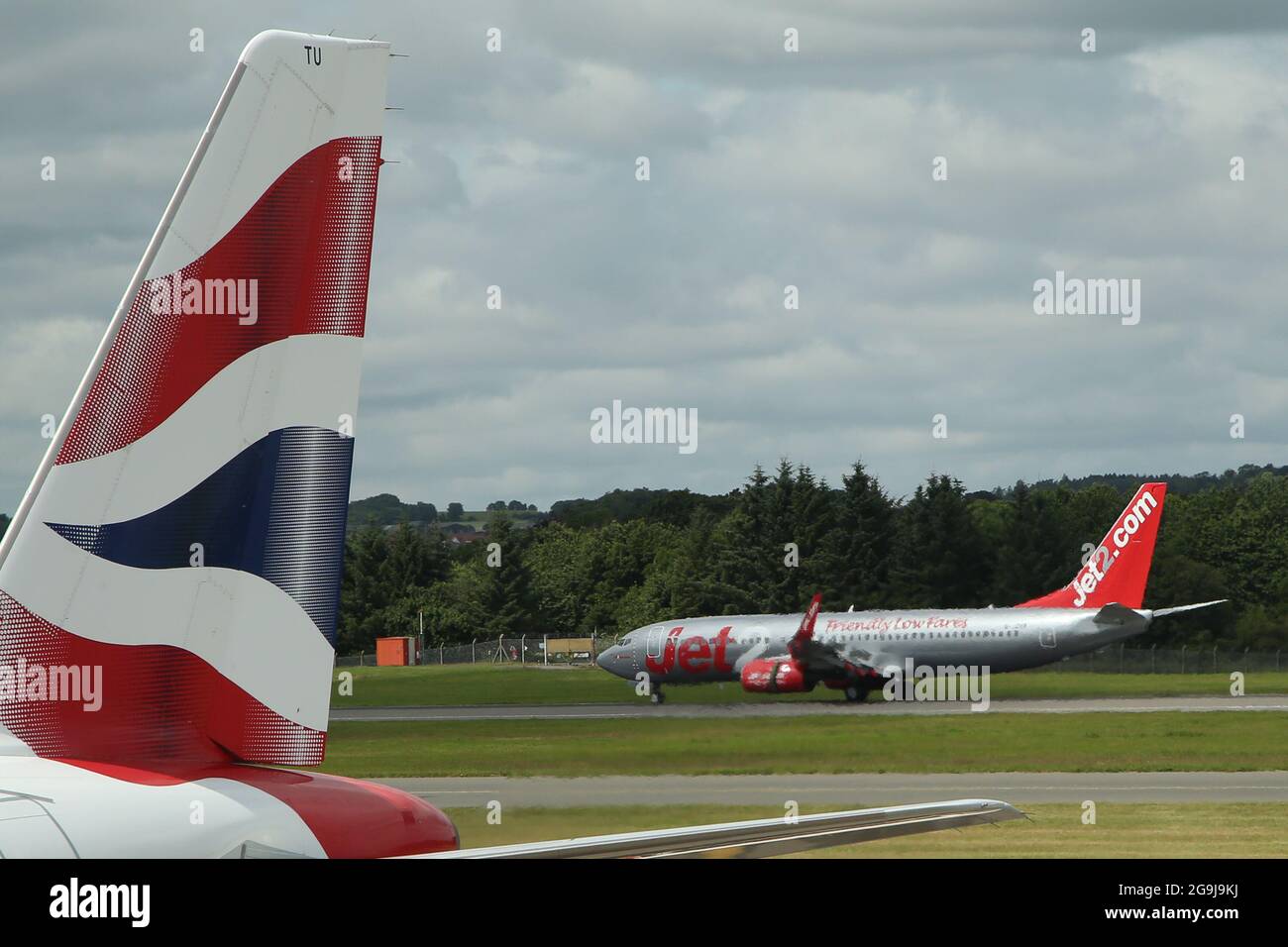 Jet2 and a British Airways aircrafts at Edinburgh Airport Stock Photo ...