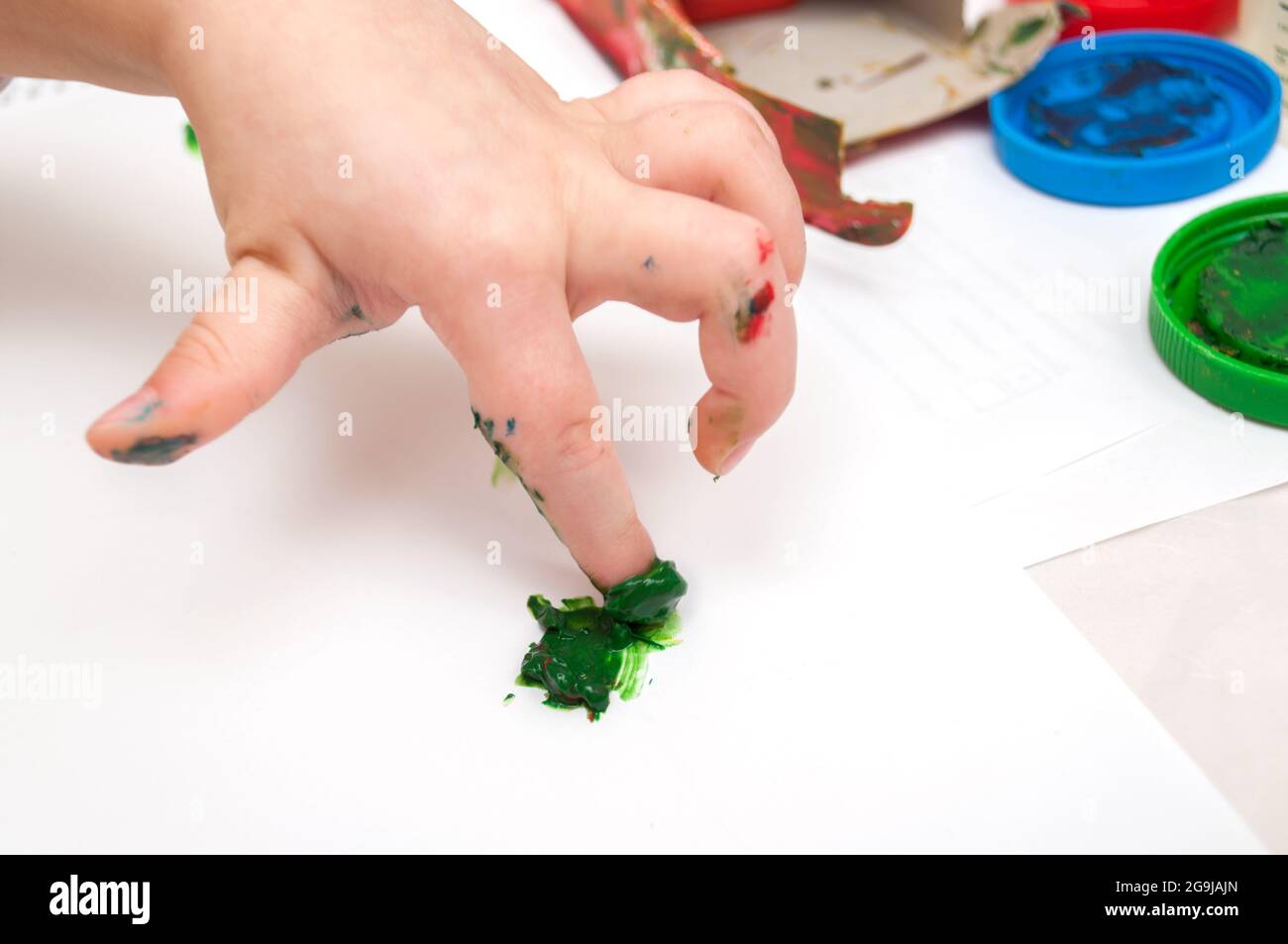 colorful finger paints over white background Stock Photo - Alamy