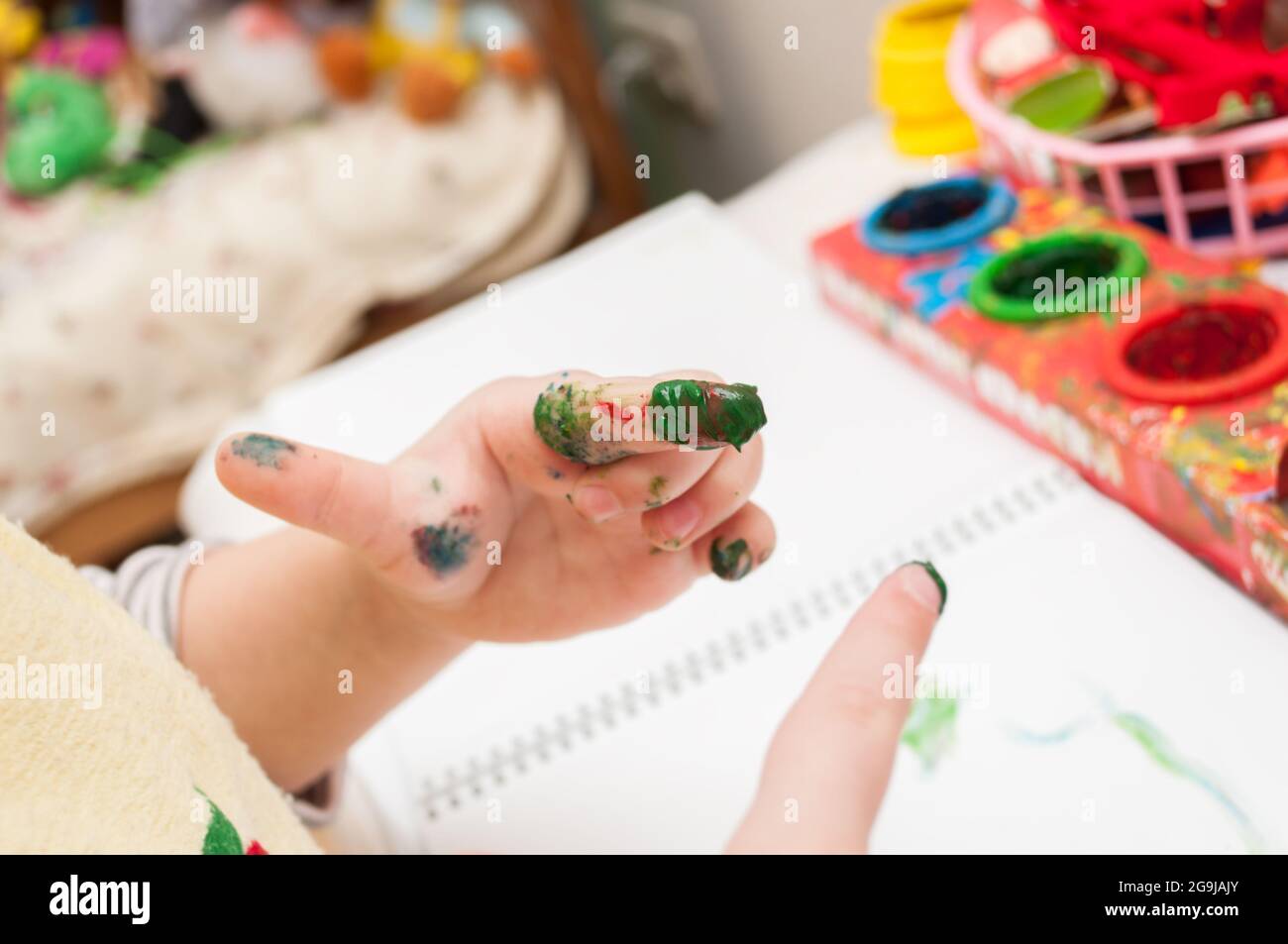 colorful finger paints over white background Stock Photo - Alamy