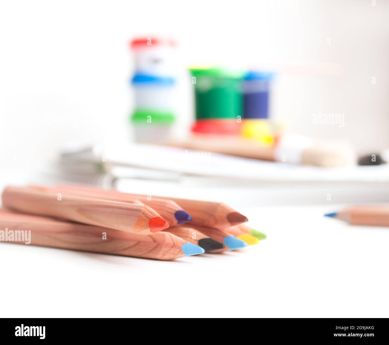 Colored pencils, paint, sketch pad, drawing, brush Stock Photo - Alamy