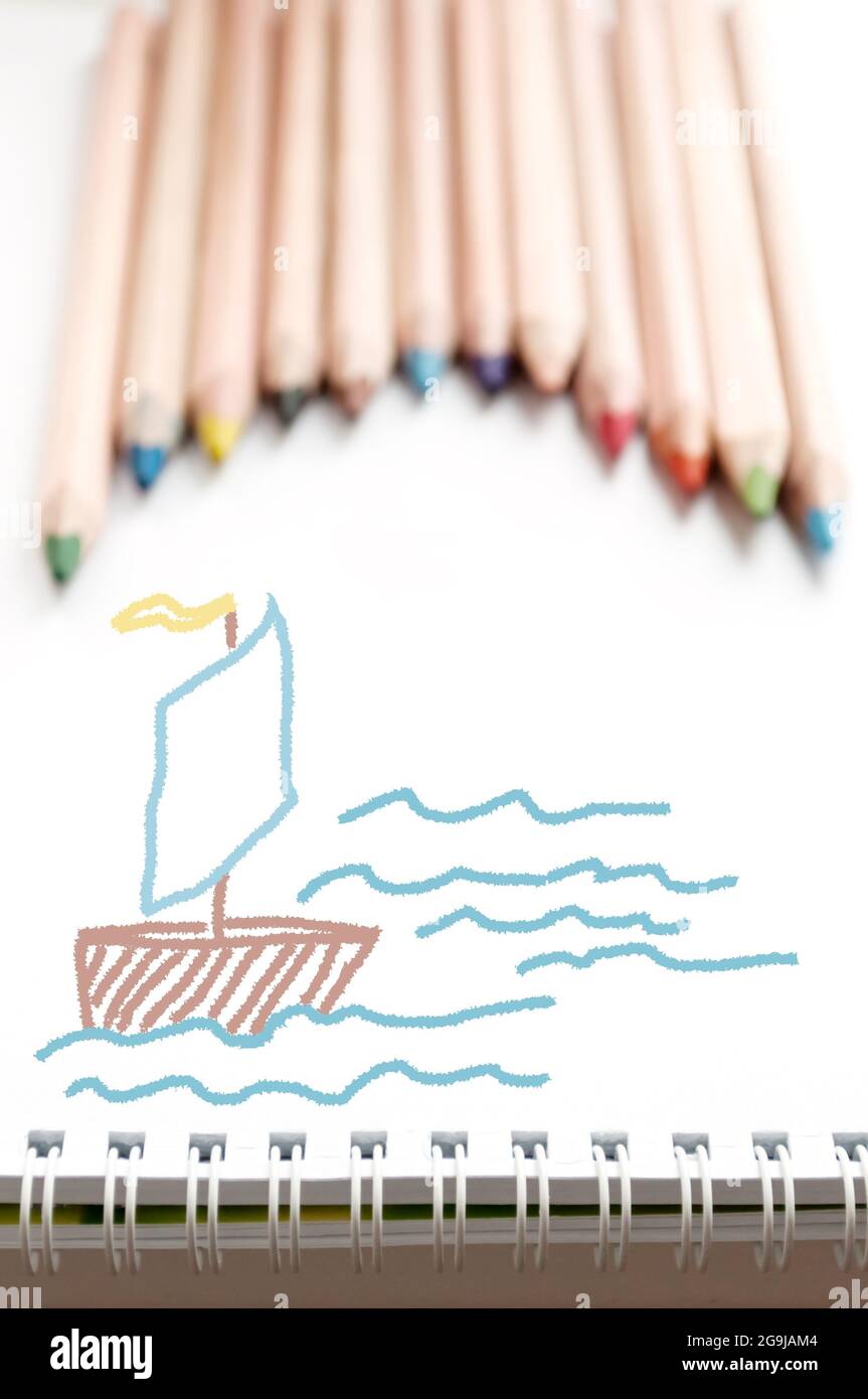paper notebook with colored pencils and drawn Stock Photo - Alamy