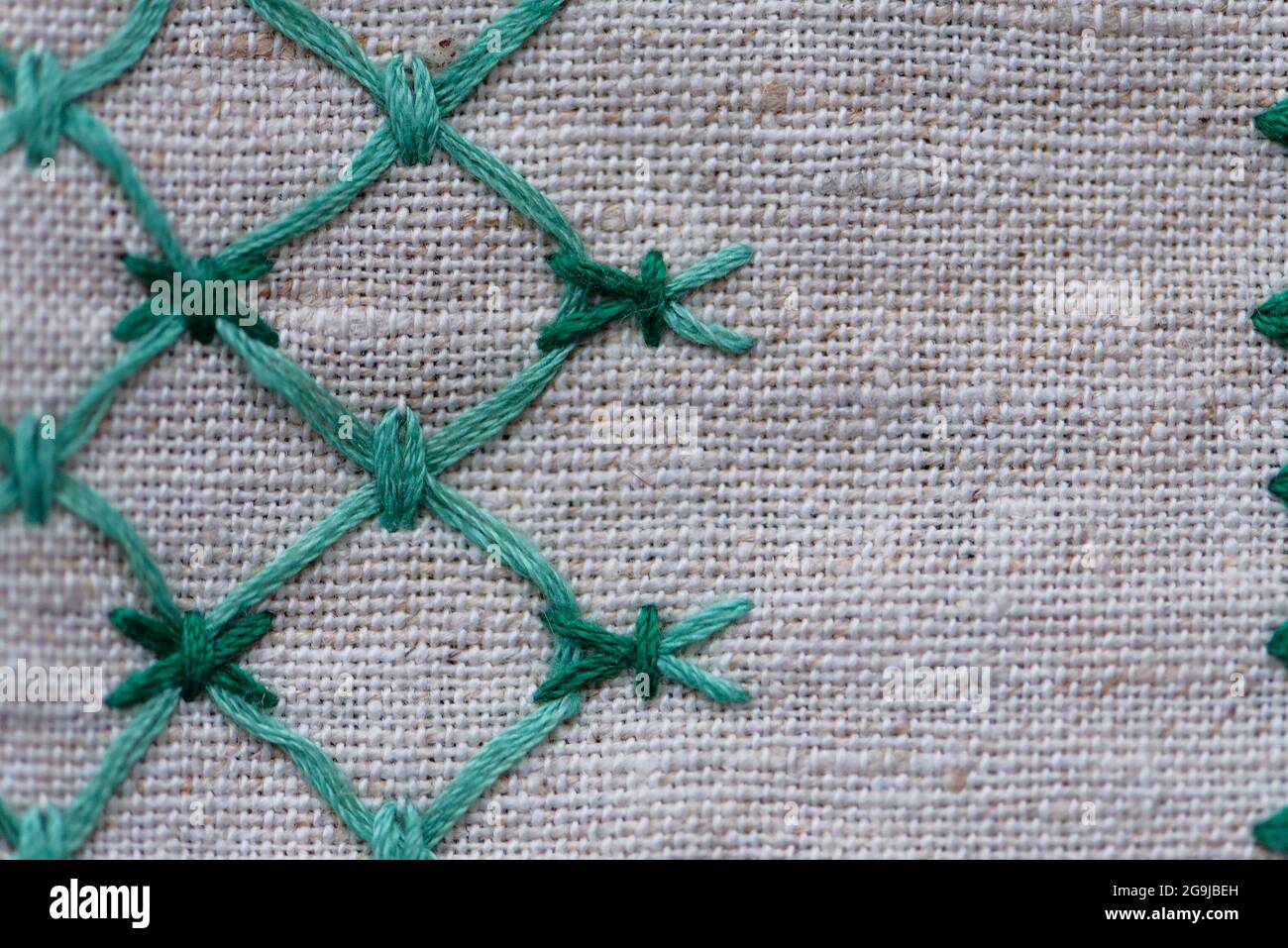 fragment of embroidered ornament on a linen napkin Stock Photo - Alamy