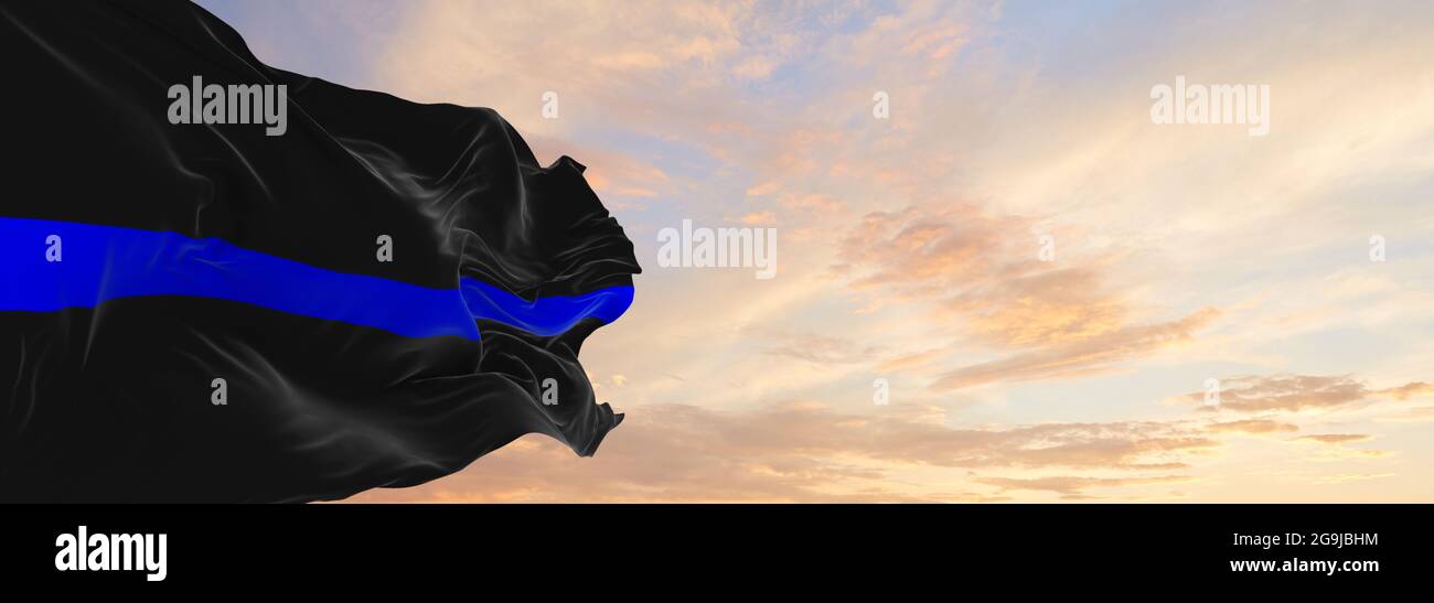 Thin Blue Line flag waving at cloudy sky background on sunset ...
