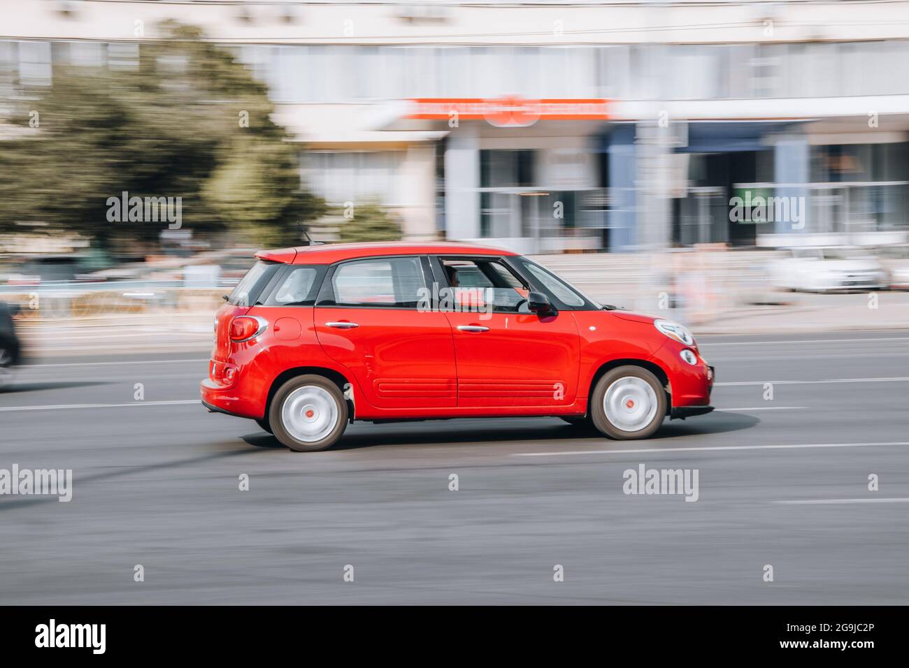 Ukraine, Kyiv - 16 July 2021: Red FIAT 500L car moving on the street ...