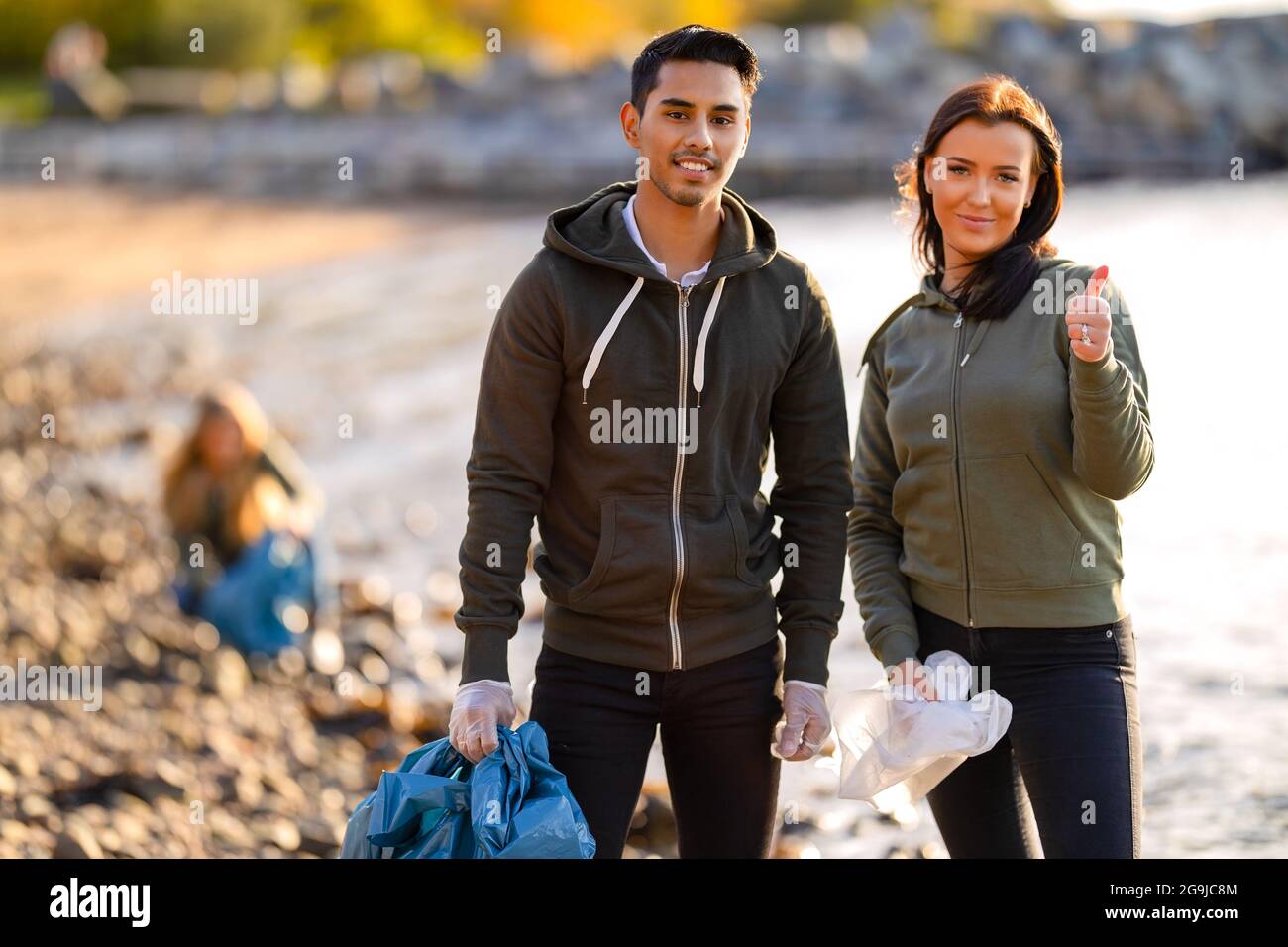 Team of young volunteers showing thumbs up at beach Stock Photo - Alamy Team of young volunteers showing thumbs up at beach Stock Photo - Alamy