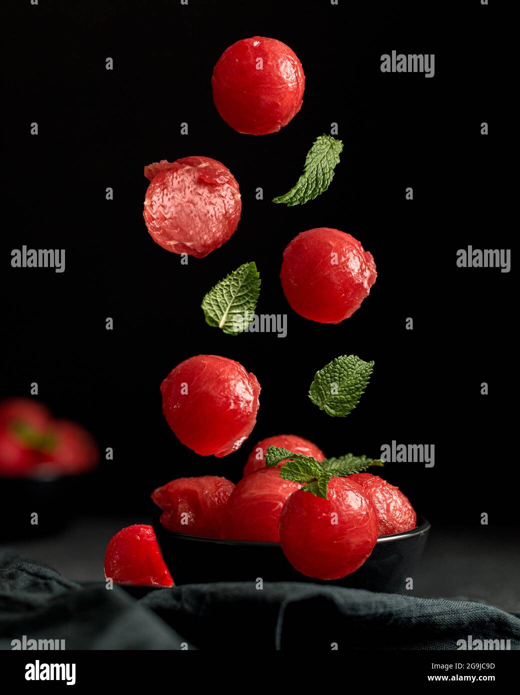 Creative concept with falling food on black backdrop Stock Photo - Alamy