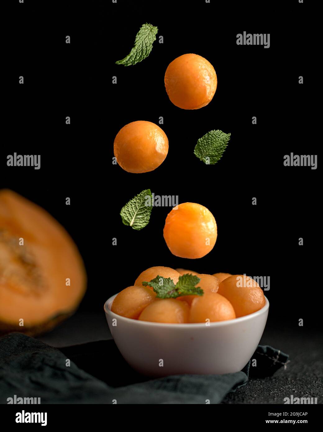 Creative concept with falling food on black backdrop Stock Photo - Alamy