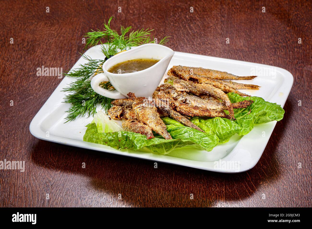 Fried barabulka fish snack with sauce Stock Photo - Alamy