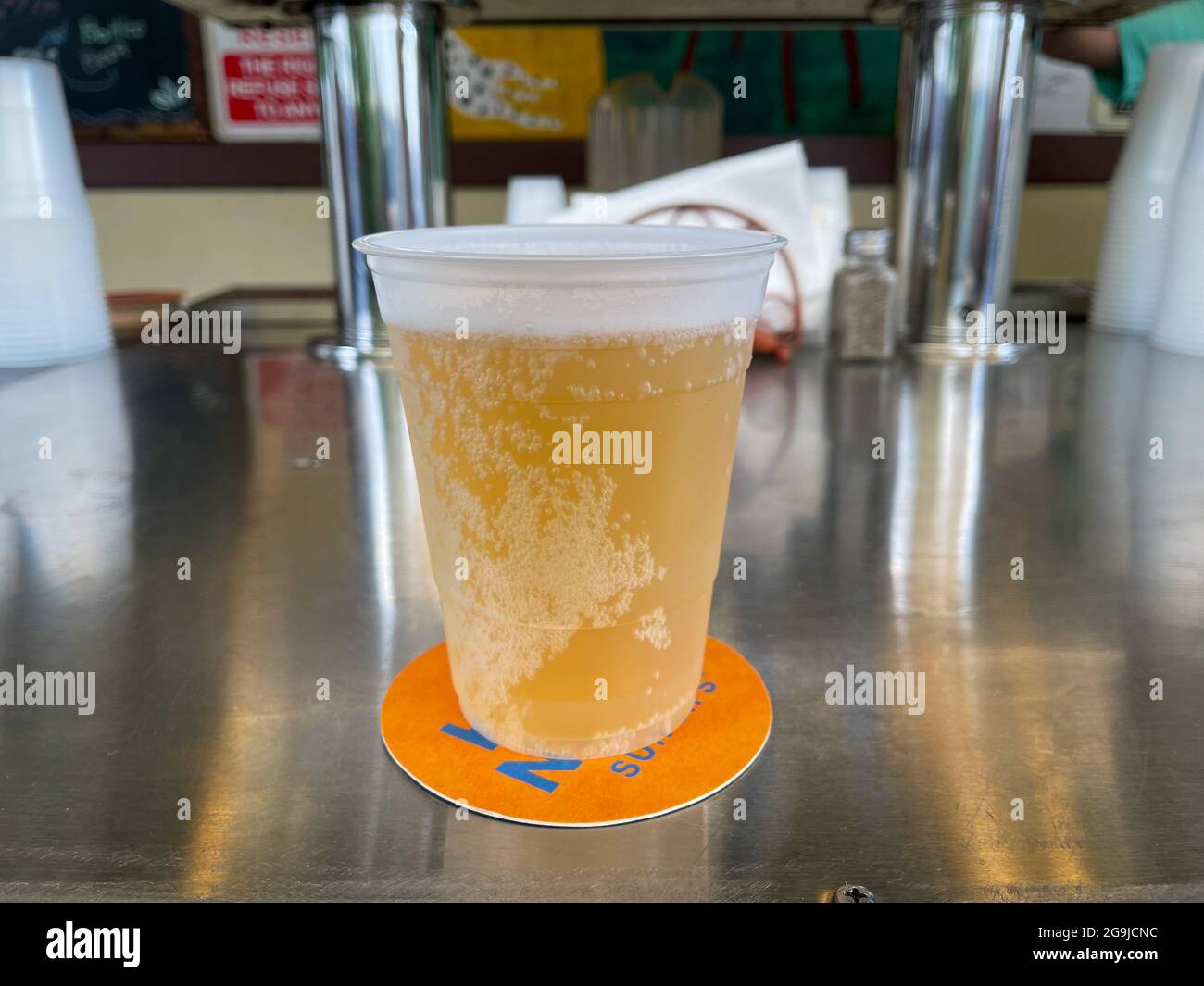 An icy cold draft beer in a glass sitting on a bar in Florida Stock ...