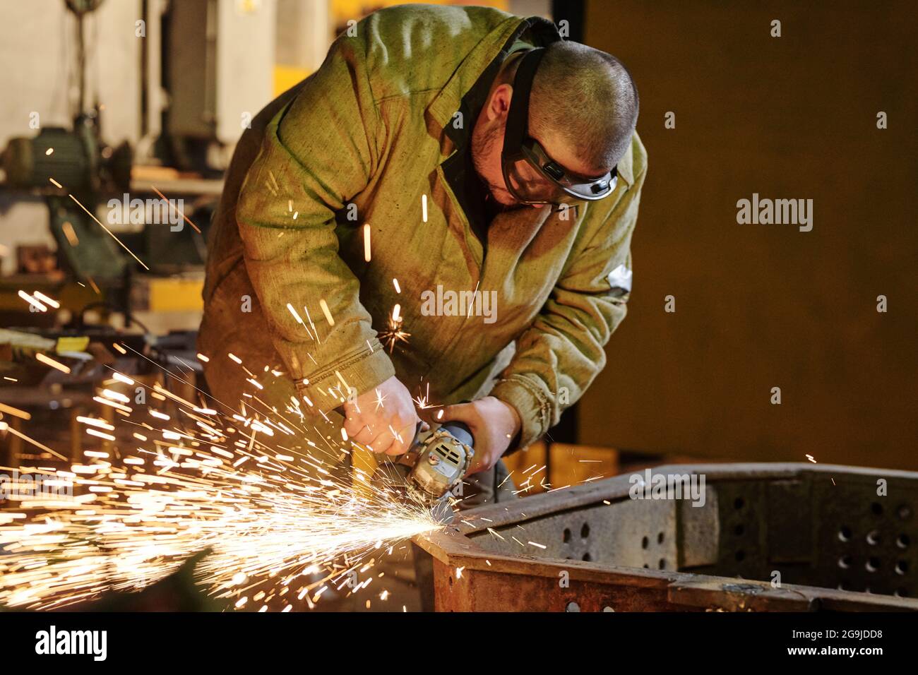 Worker using grinder hi-res stock photography and images - Alamy