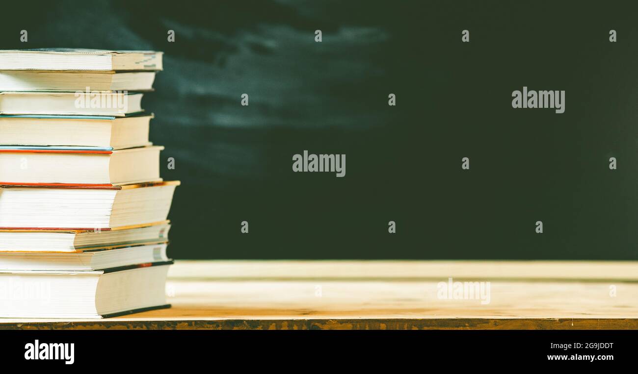 back to school concept pile of books and chalkboard Stock Photo - Alamy