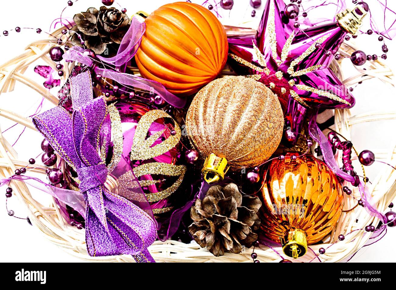 Lilac and gold Christmas baubles on white background Stock Photo - Alamy
