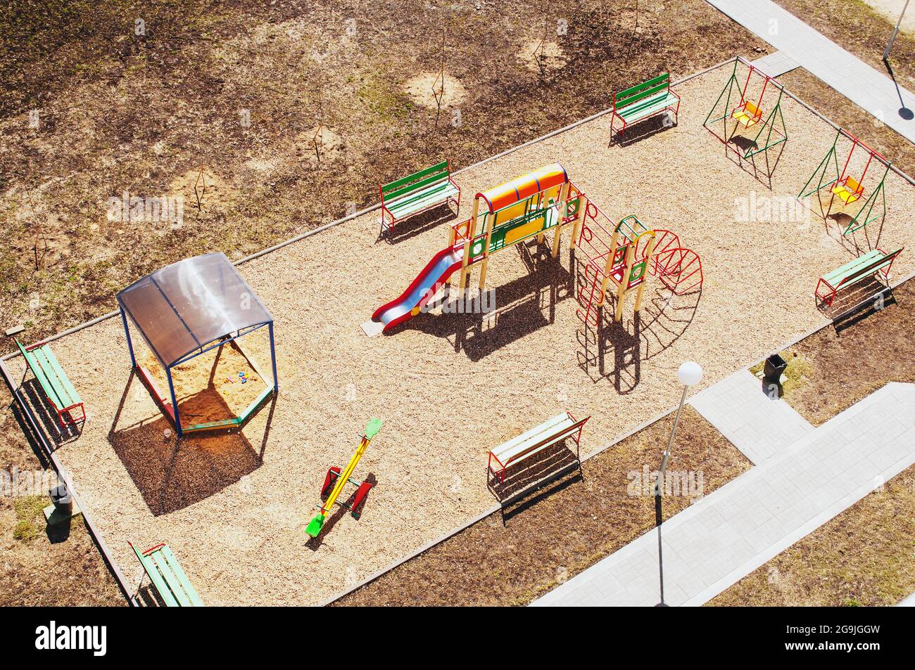 Empty chain swings on kids playground Stock Photo - Alamy