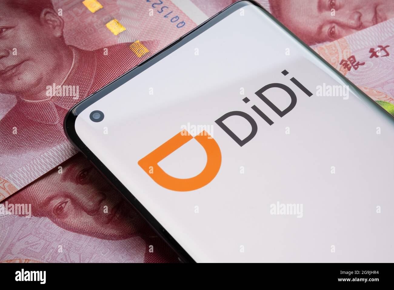 Didi Chuxing Technology company logo seen on smartphone placed on 100 ...