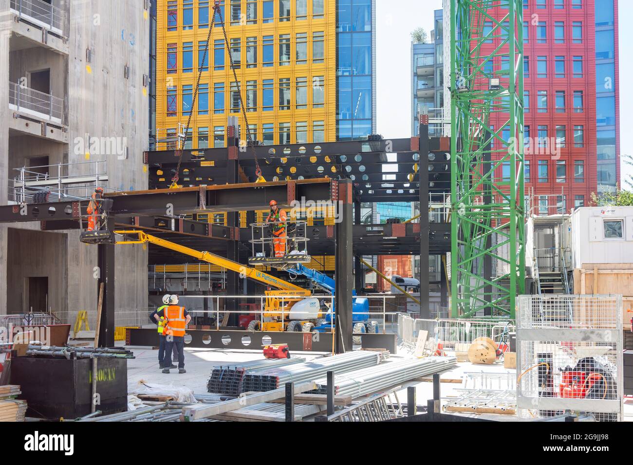 Construction workers on building site, New Oxford Street, London ...