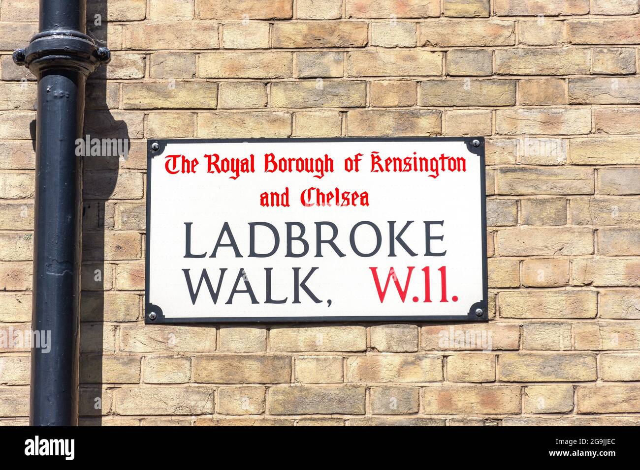 W 11 sign signs tin mews cobbled street houses housing property hi-res ...