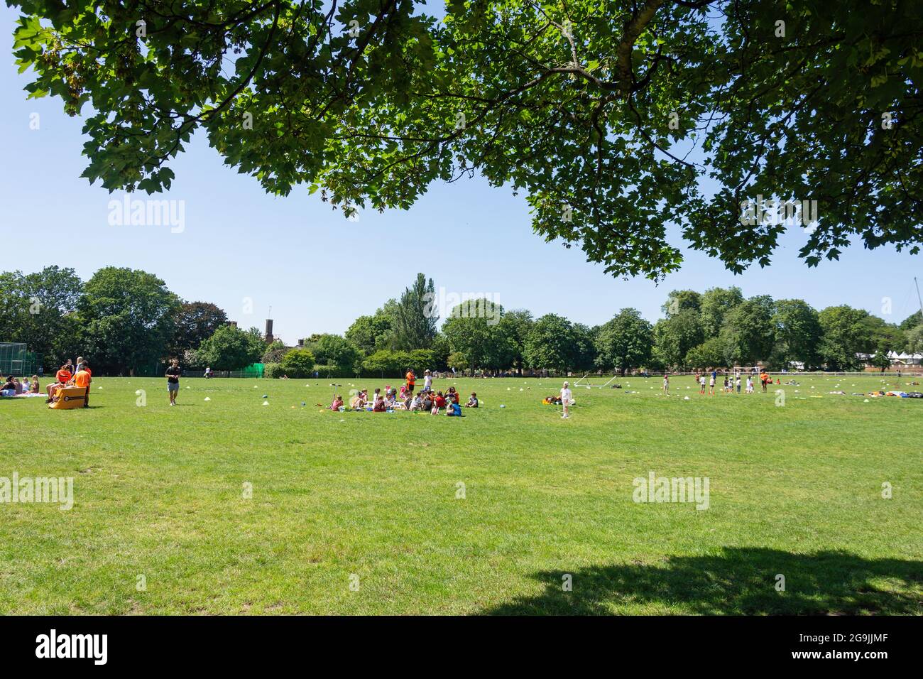 Children playing groups sport holland park sports field gardens hi-res ...