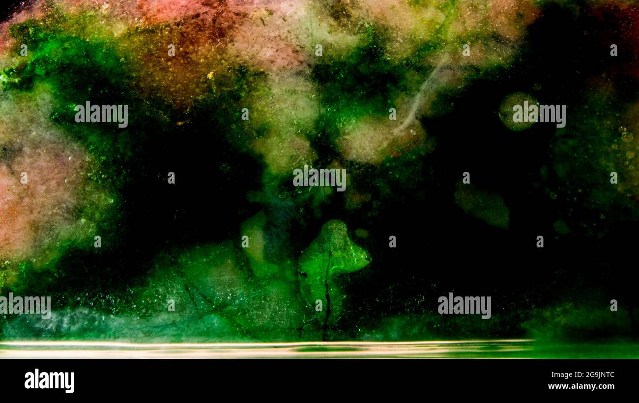 Multicolored ice plate melting, colors overflowing Stock Photo - Alamy