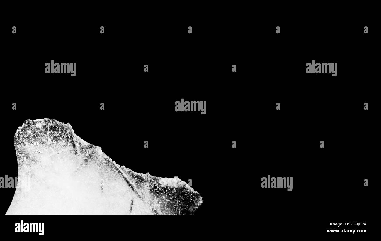 Ice plate melting, high contrast black background Stock Photo - Alamy