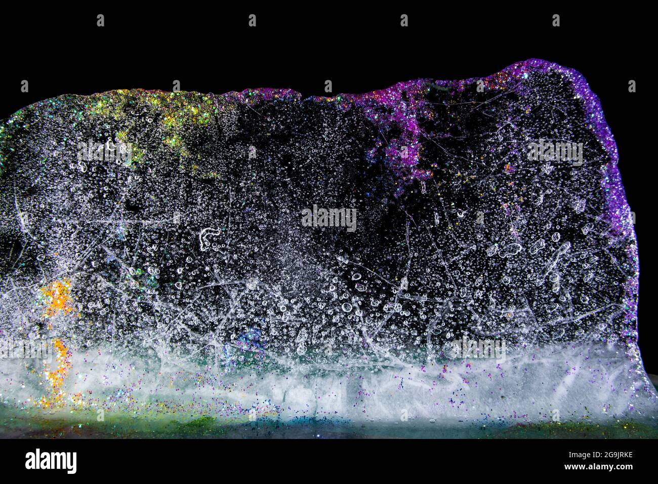 Colored ice with glitter, melting. Glitter and colors! Transparent and ...