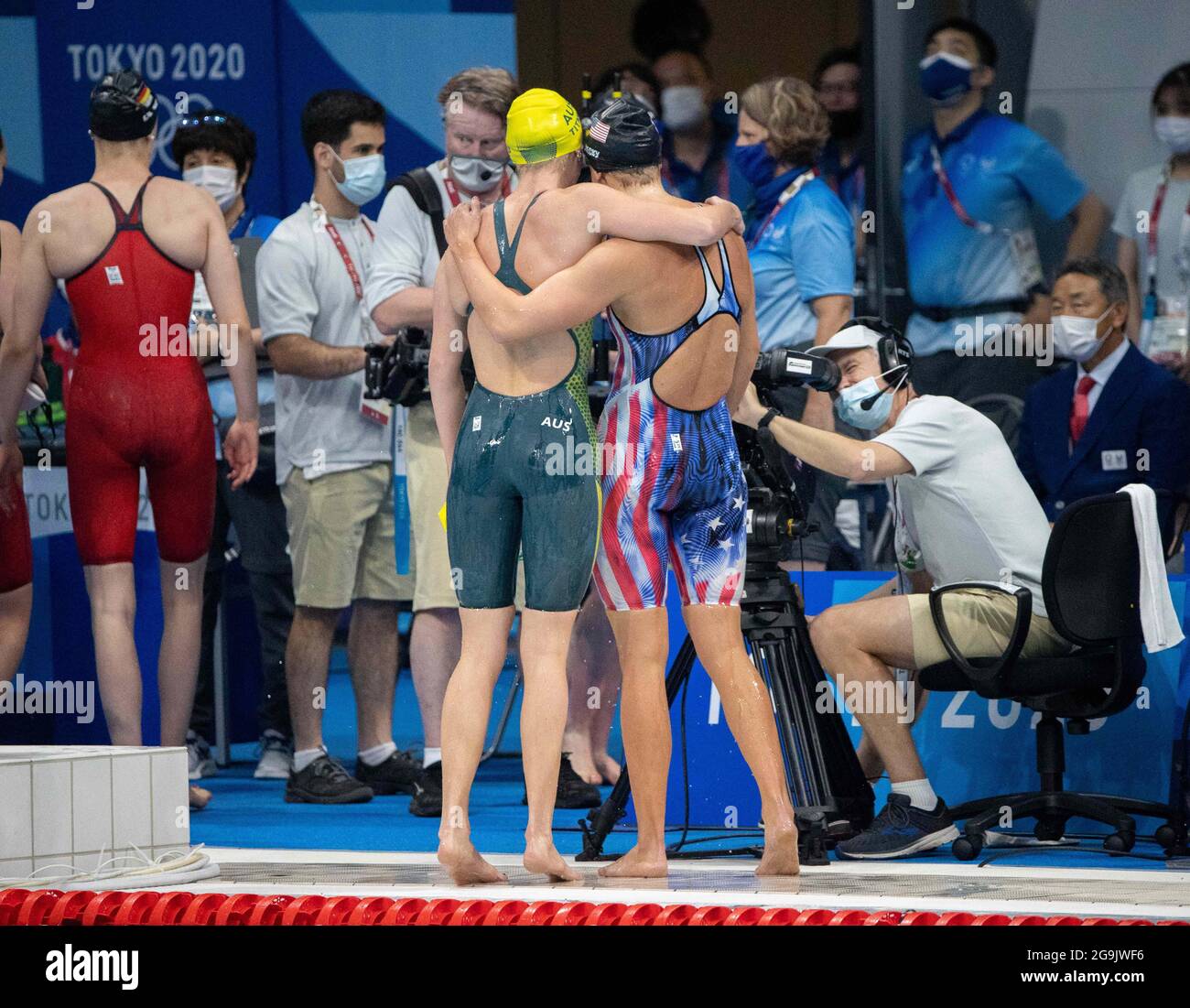 Tokyo, Japan. 26th July, 2021. ARIARNE TITMUS of Australia and Katie Ledecky of USA embrace ...