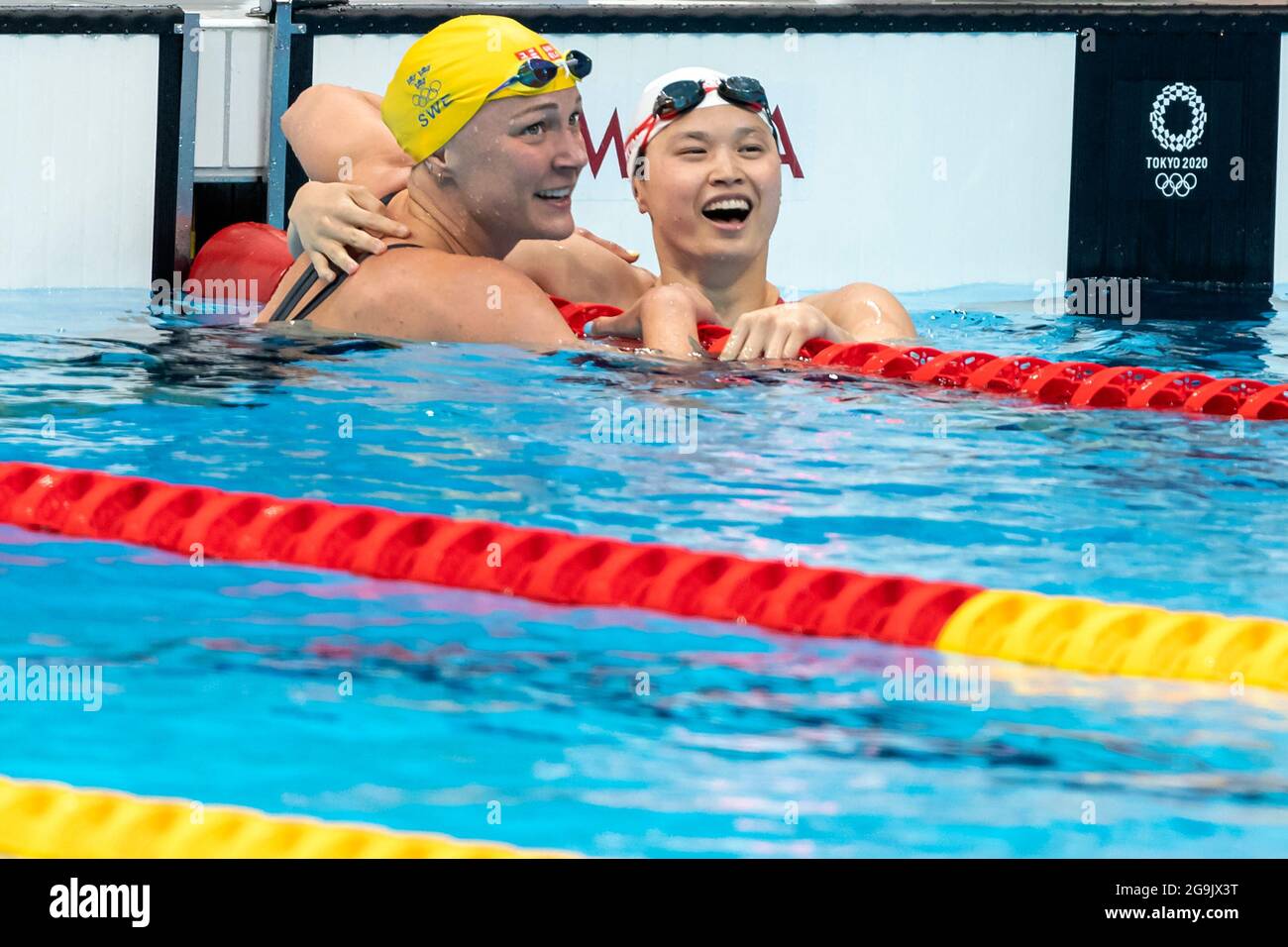 TOKYO, JAPAN - JULY 26: Margaret Macneil of Canada (r) celebrates with ...