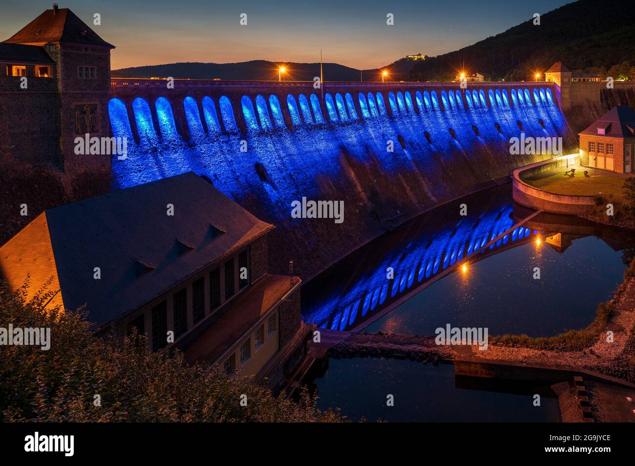 Illuminated dam wall in the evening twilight, Edersee, Ederstausee ...