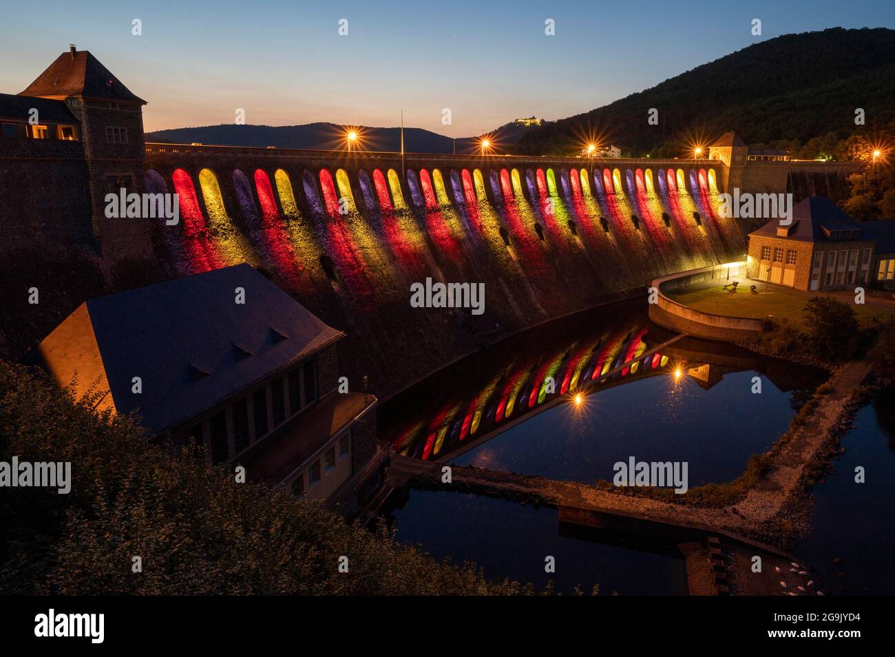 Illuminated dam wall in the evening twilight, Edersee, Ederstausee ...