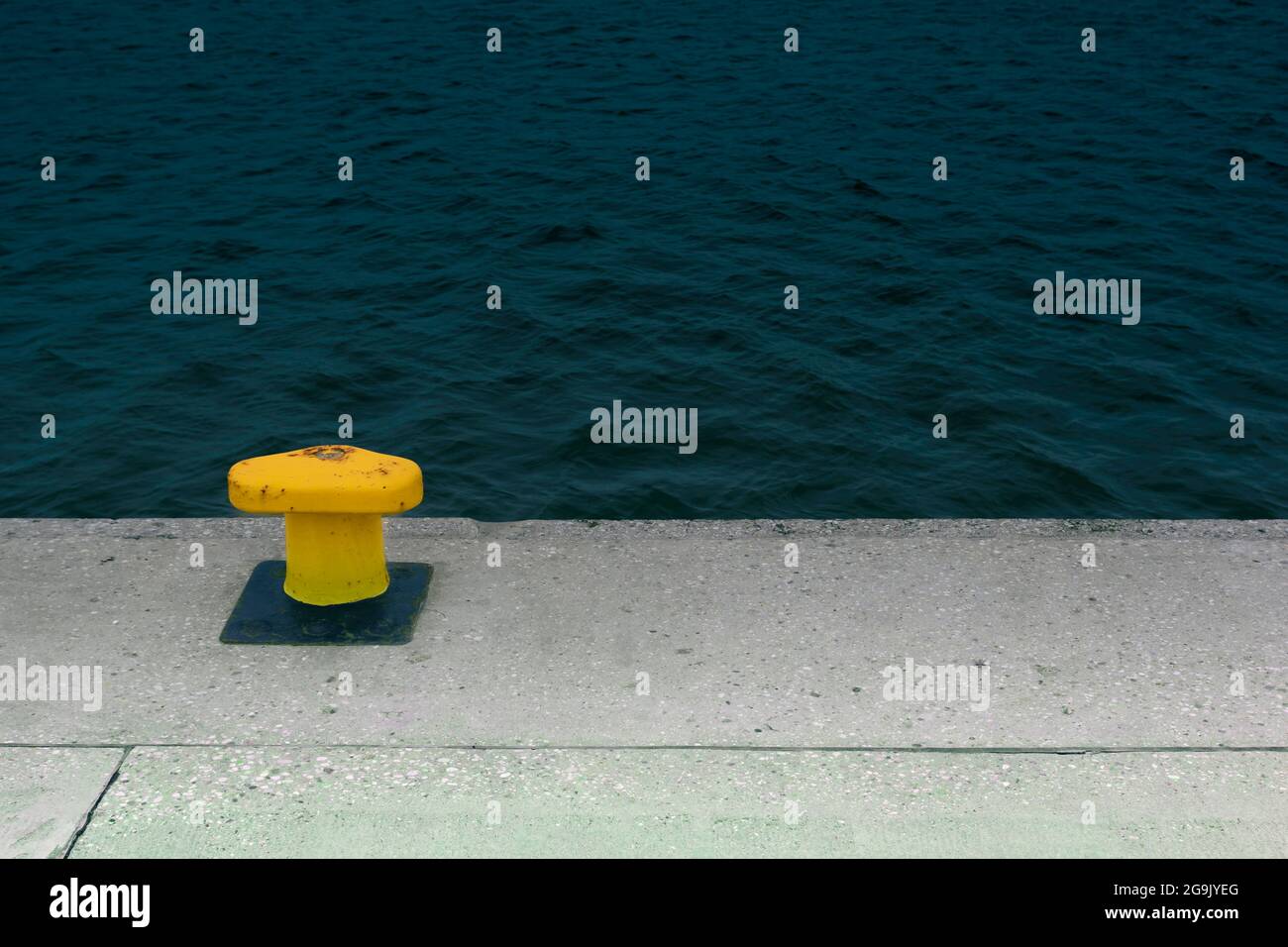 Yellow Bollard, left side, Background image, Harbor, Poland Stock Photo ...