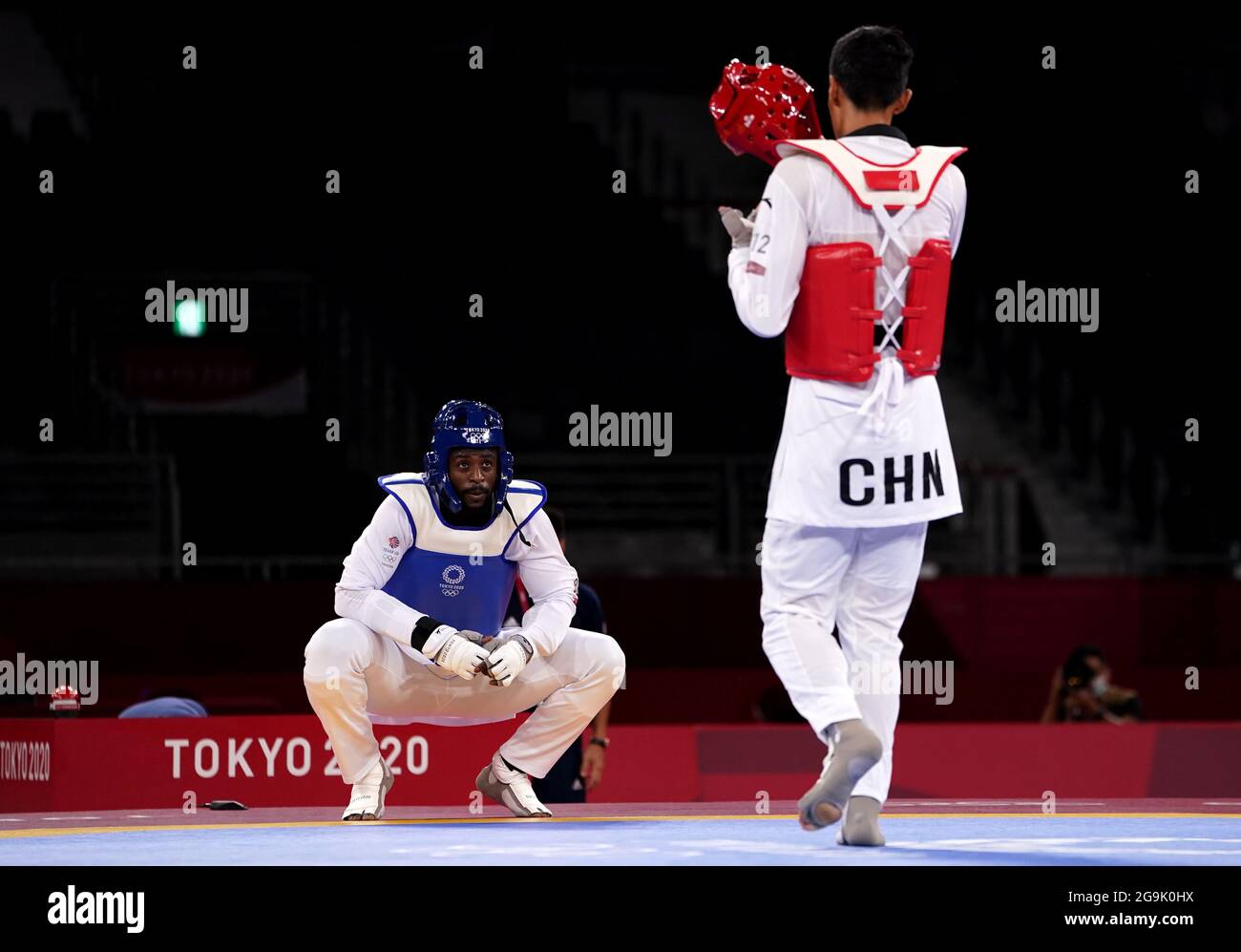 Great Britain's Mahama Cho (left) reacts after losing to China's Hongyi ...