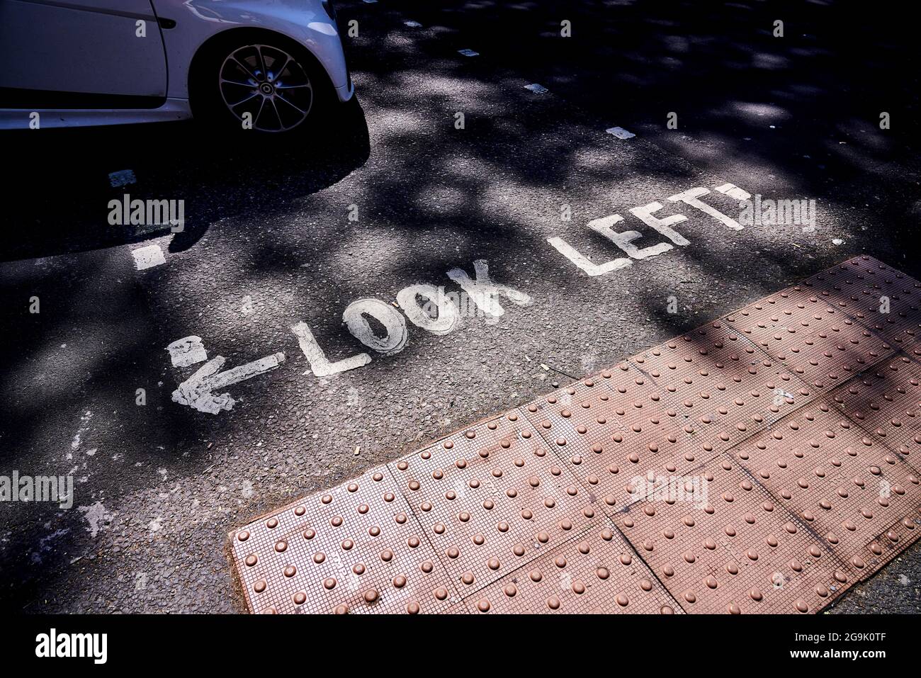 LOOK LEFT lettering on street with nubbed plate guide system for the ...