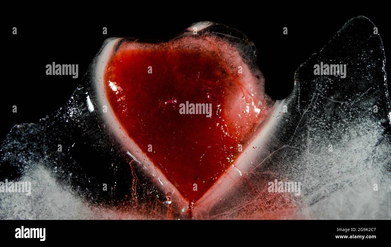 Red heart, frozen in ice melting, bleeding. LOVE! Stock Photo - Alamy