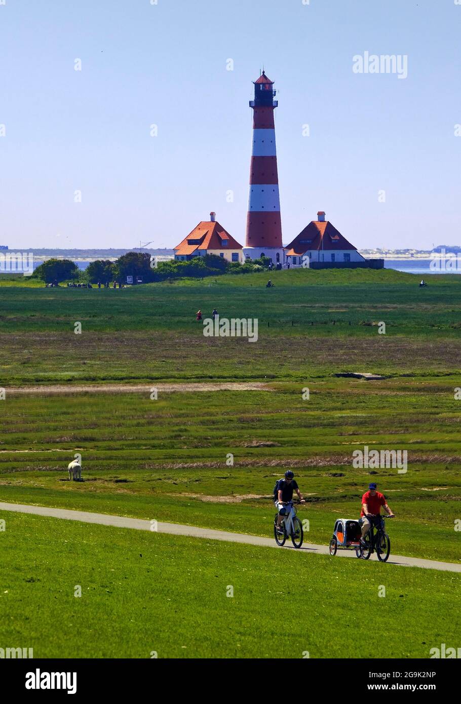 Westerhever Lighthouse with cycling, Eiderstedt, Wadden Sea National ...