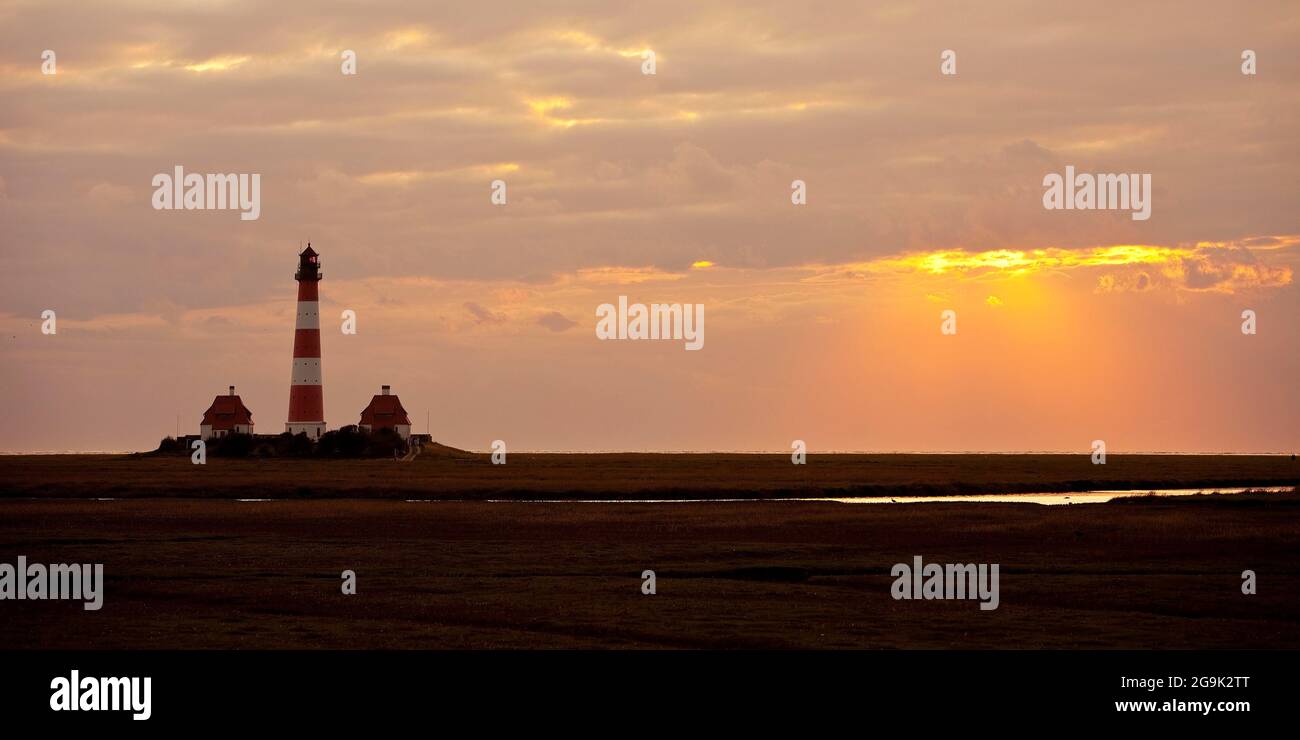 Westerhever Lighthouse at sunset, Wadden Sea National Park, North Sea ...