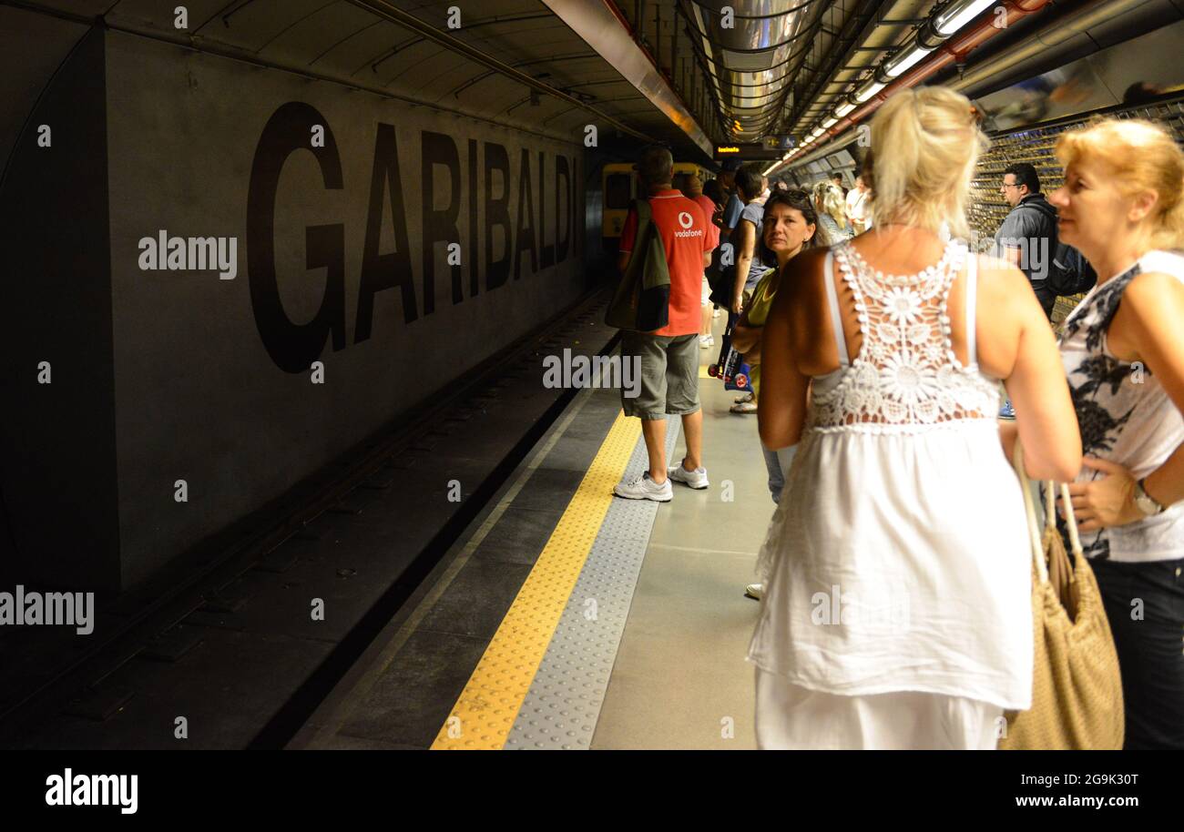 Commuters waiting for the metro train at Garibaldi station in Naples ...